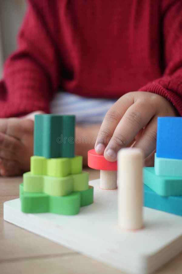 Child Engages Colorful Stacking Blocks Playful Setting Stock Photos ...