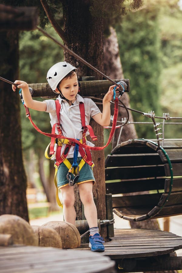 Child Enjoying Activity in a Climbing Adventure Park on a Summer Day ...