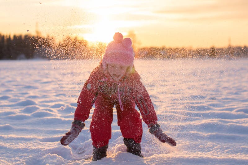 Child Enjoying the Falling Snow Stock Photo - Image of outdoors ...