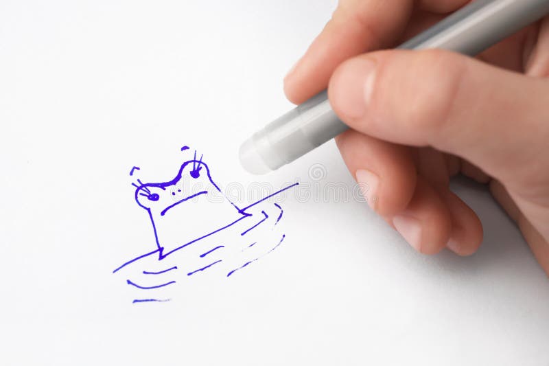 Child Erasing Drawing with Erasable Pen on Paper Sheet, Closeup Stock ...