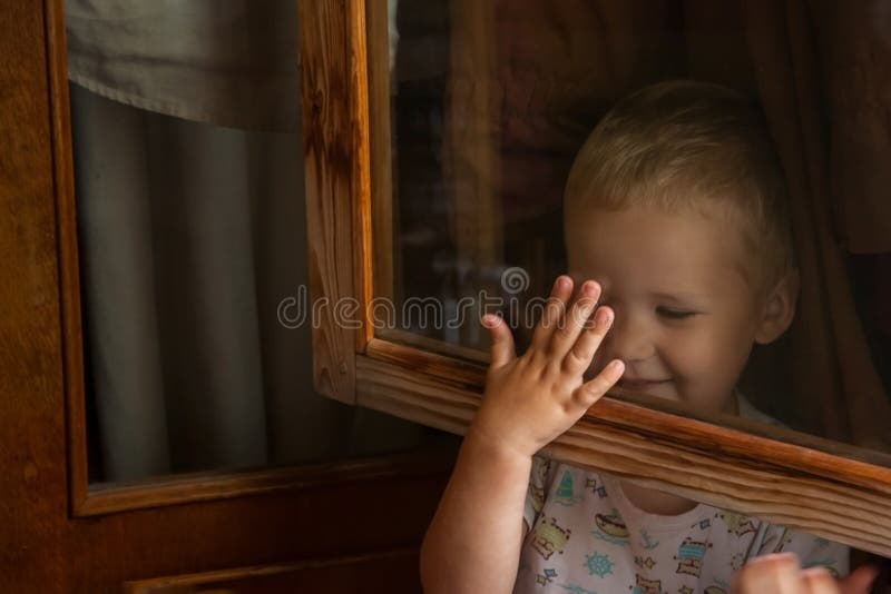 The Child Examines the Other Hand, Palm through the Glass Stock Image ...
