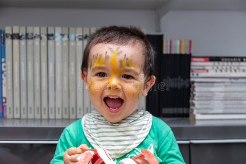 Child with a Face Full of Paint Stock Image - Image of portrait ...