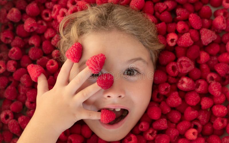 Child Face with Raspberry Frame, Close Up Raspberry Background. Stock ...