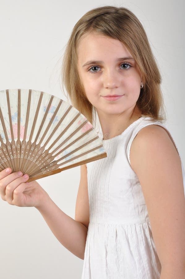 Child with a fan stock photo. Image of person, young - 22986796