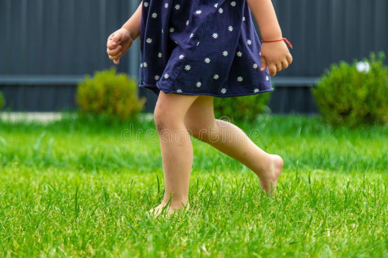 Child Feet on the Grass. Selective Focus Stock Image - Image of meadow ...