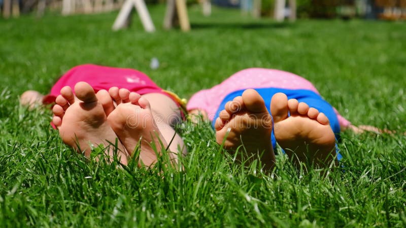 Children S Feet Drawn on the Grass. Selective Focus Stock Footage ...