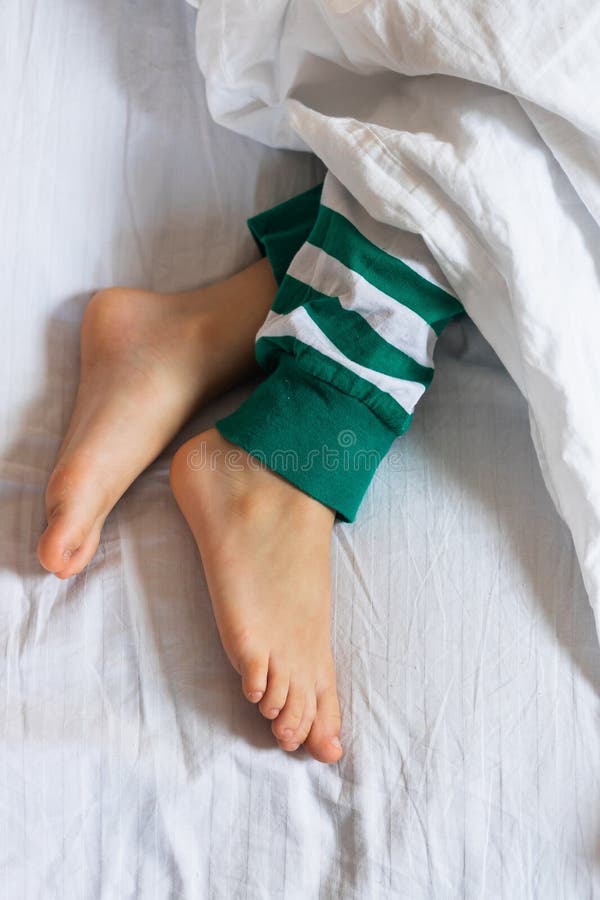 Child Feet Under the White Blanket, Top View Stock Photo - Image of ...