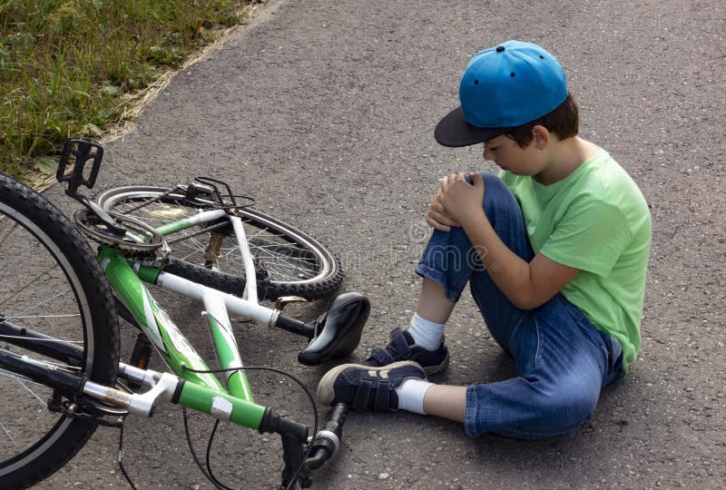 Child Fell Off Bicycle. Boy Keeps Self for Bruised Knee Stock Image ...