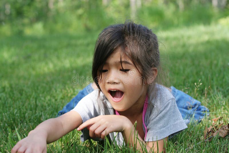 Child Finding Object in Grass Stock Image - Image of active, finding ...