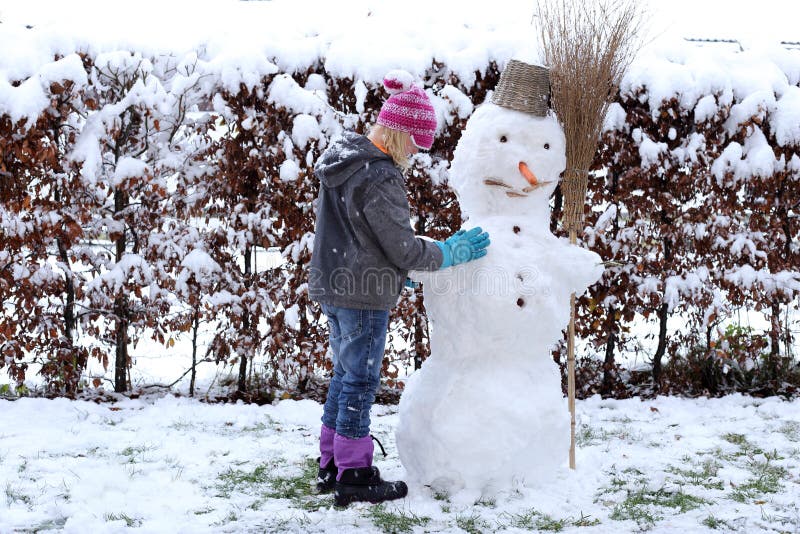 Child with first snow stock photo. Image of happiness - 63498076