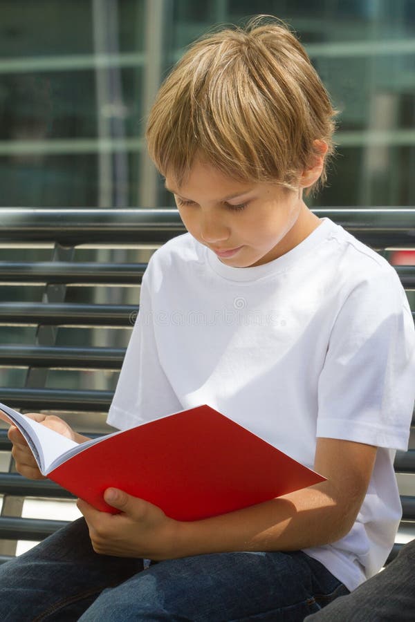 Child Flipping through Book Pages Outdoors Stock Photo - Image of ...