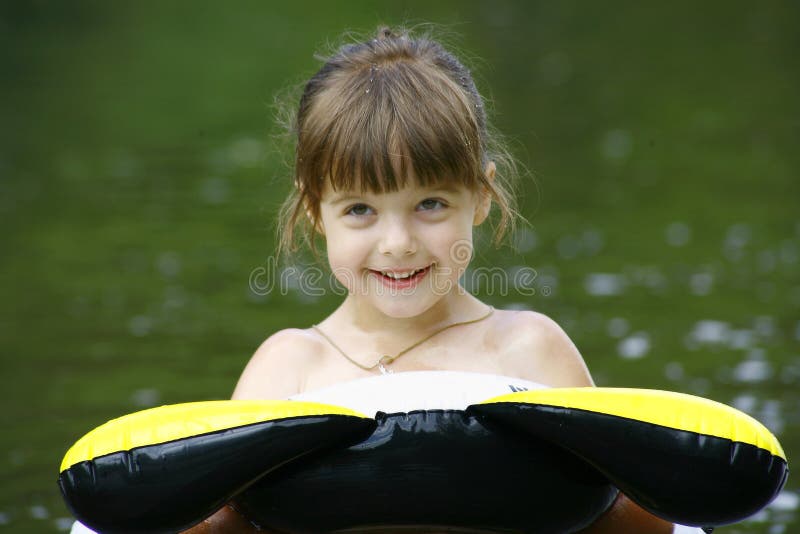 .a Child is Floating in an Inflatable Rubber Circle in the Form of an ...