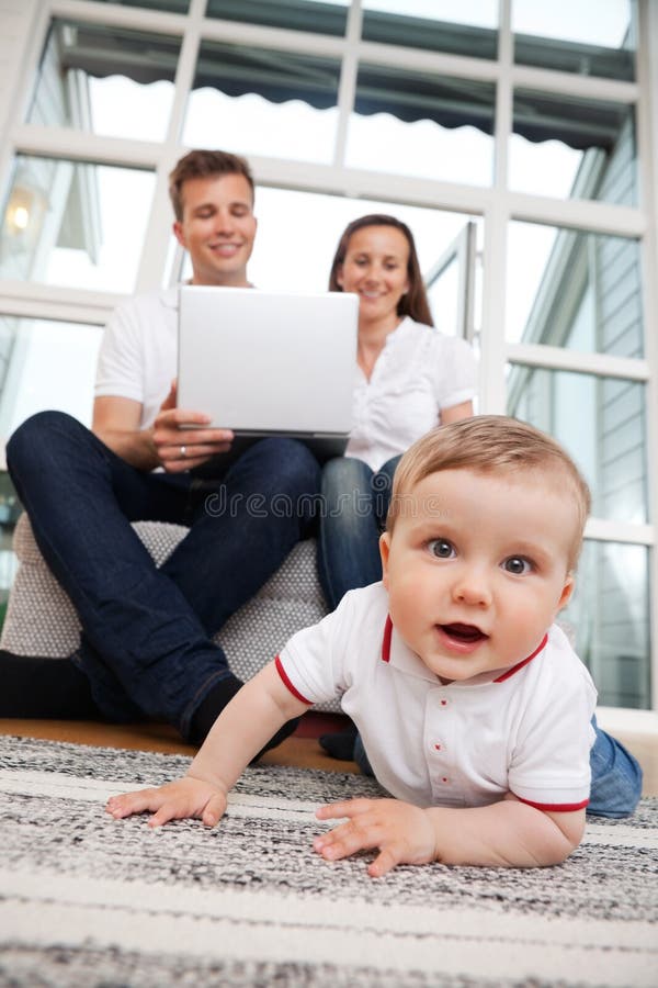 Young Parents, with Child, on Laptop Computer Stock Image - Image of ...