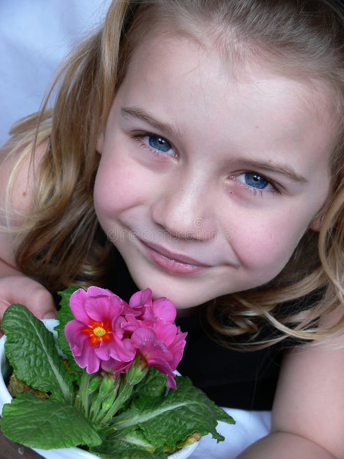 Child with flower stock image. Image of little, cute, primrose - 4636565