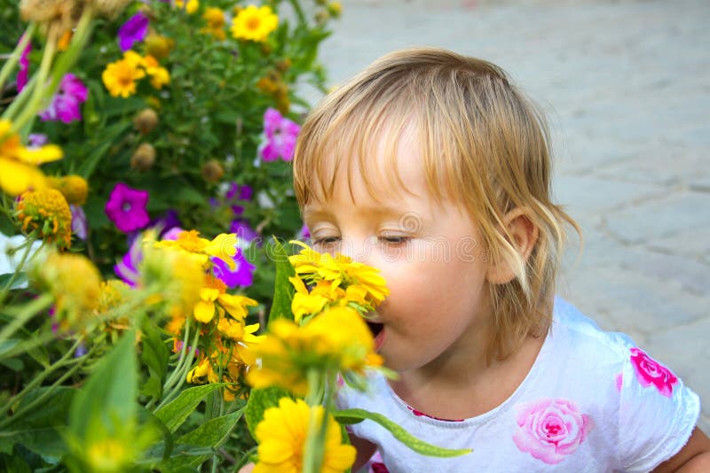 Child with flower portrait stock image. Image of family - 13361981