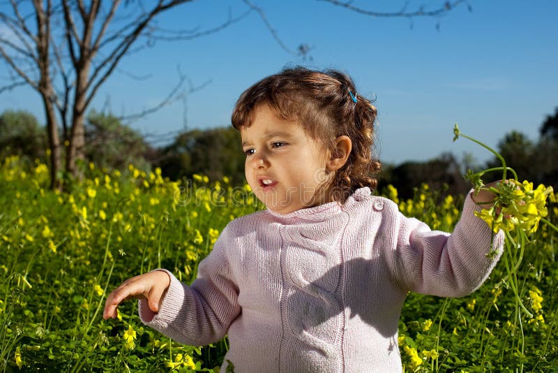 Child with flowers stock photo. Image of gardening, garden - 7557174