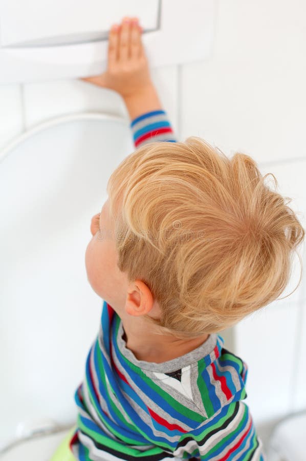 Child flushing the toilet stock image. Image of happy - 43045391