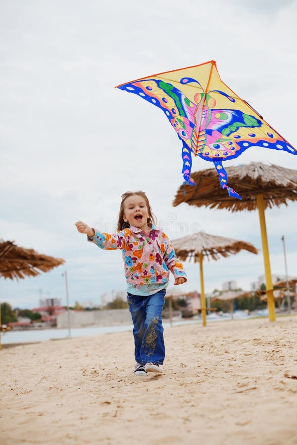 Child flying a kite stock image. Image of female, happy - 11372667