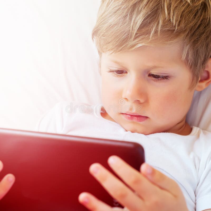 Child Focused on Screen Tablet. Theme of Modern Technologies Stock ...