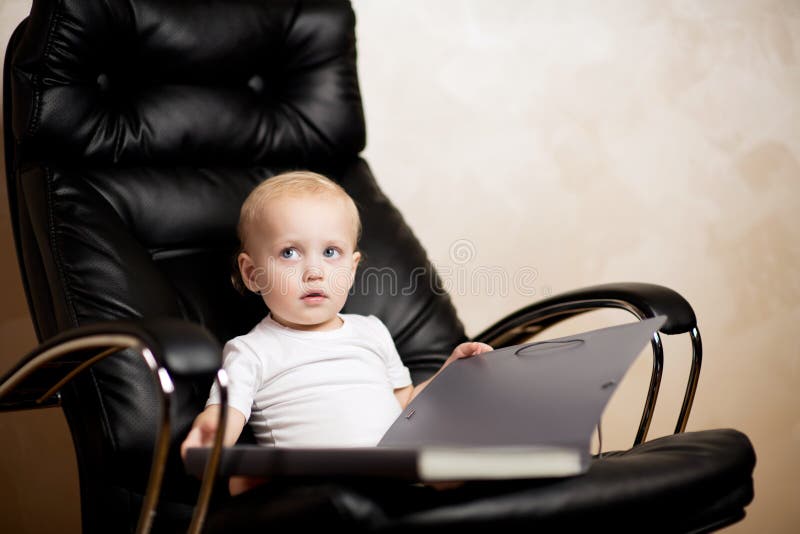 Child with a Folder for Documents in an Office Chair Stock Image ...