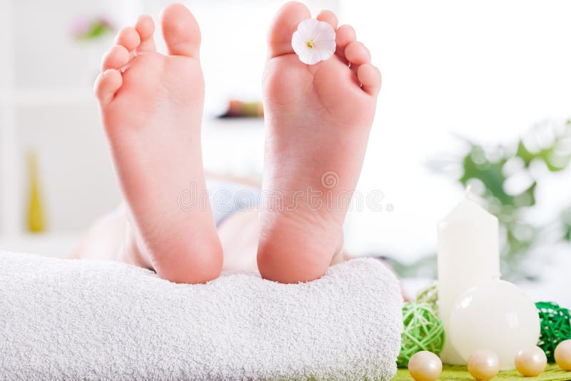 Child Foot Ready To Spa Treatment with Massage Stones Stock Photo ...