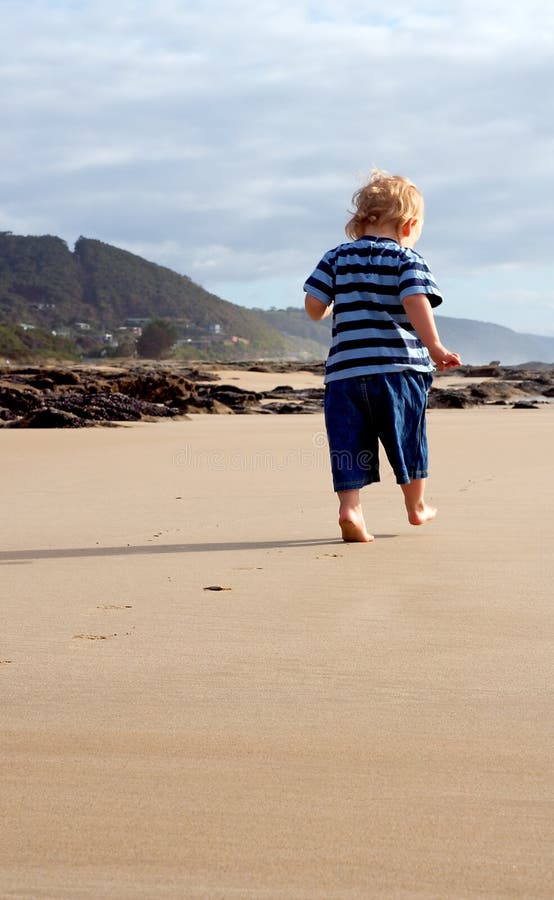 Child footsteps in sand stock image. Image of ocean, cloud - 2393363