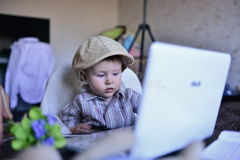 A Child in Front of a Computer is Studying or Working at Home Stock ...