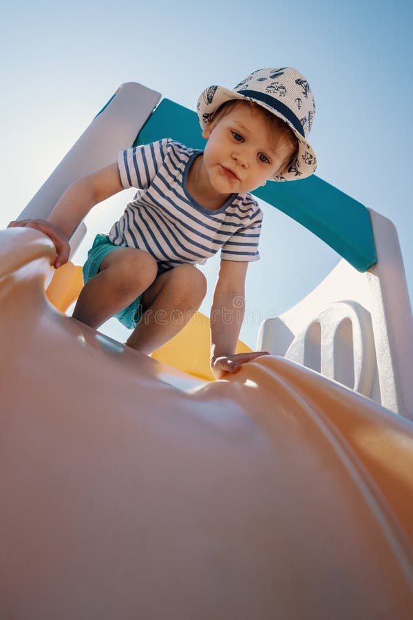 The Child is Getting Ready To Slide Off the Slider Stock Image - Image ...