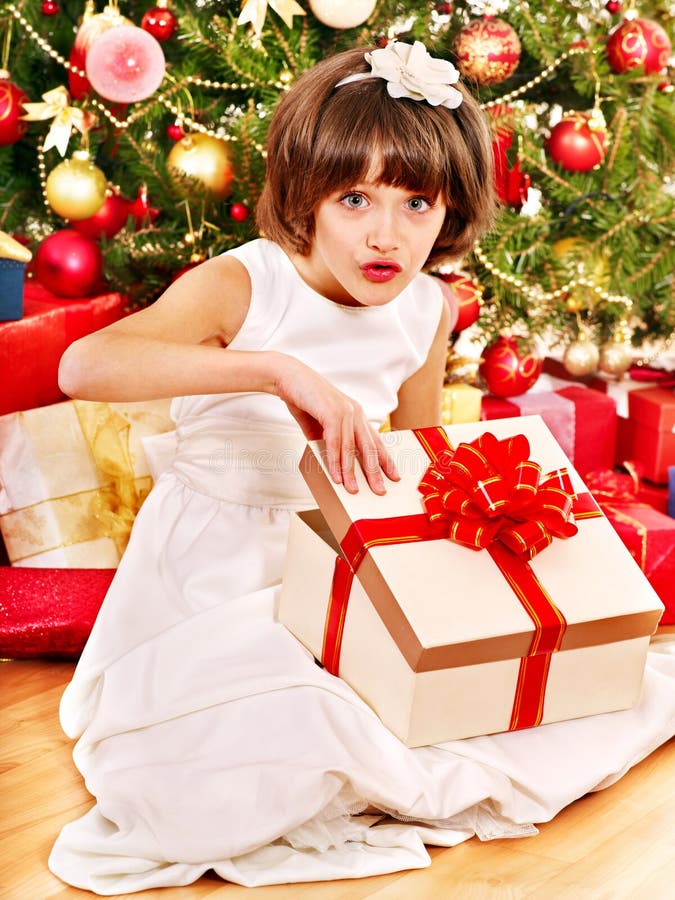 Child with Gift Box Near Christmas Tree. Stock Image - Image of ...