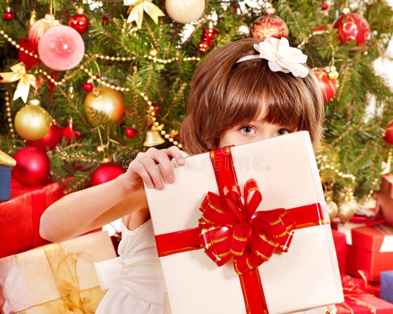 Child with Gift Box Near Christmas Tree. Stock Image - Image of ...