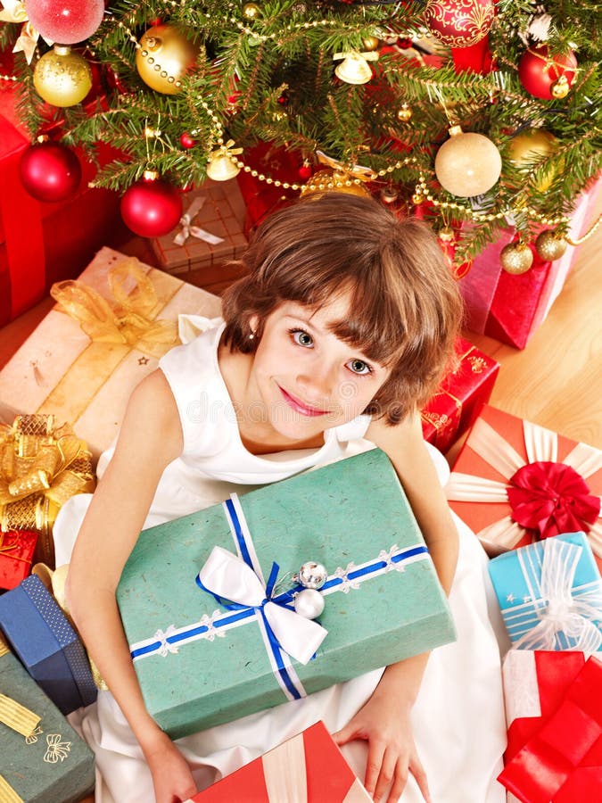 Child with Gift Box Near Christmas Tree. Stock Image - Image of girl ...