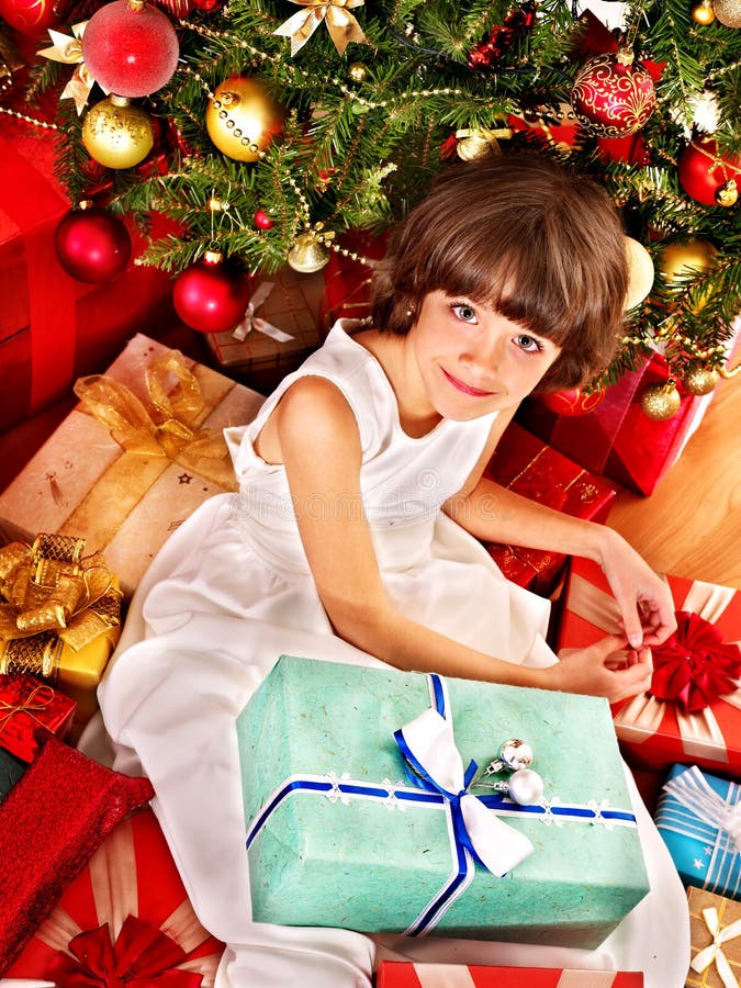 Child with Gift Box Near Christmas Tree. Stock Image - Image of ...