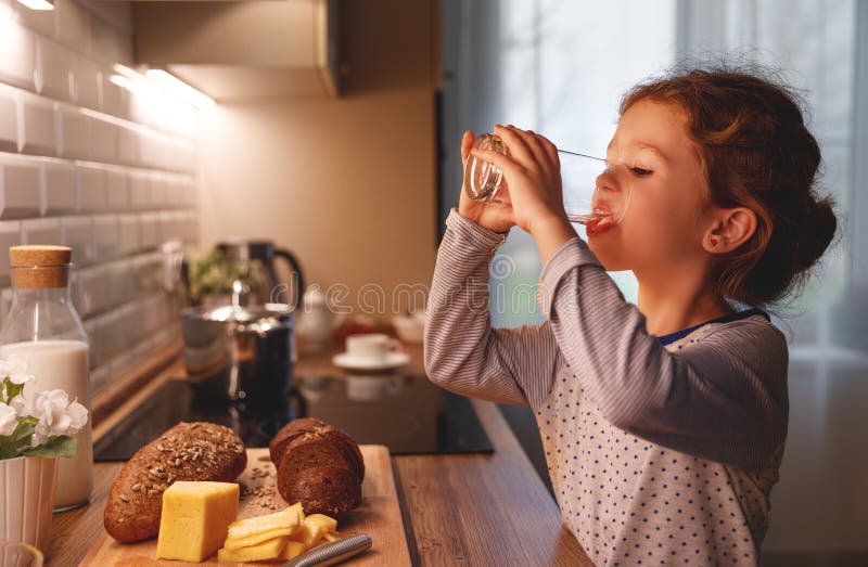 Child Girl is Drinking Water in Kitchen at Home Stock Image - Image of ...