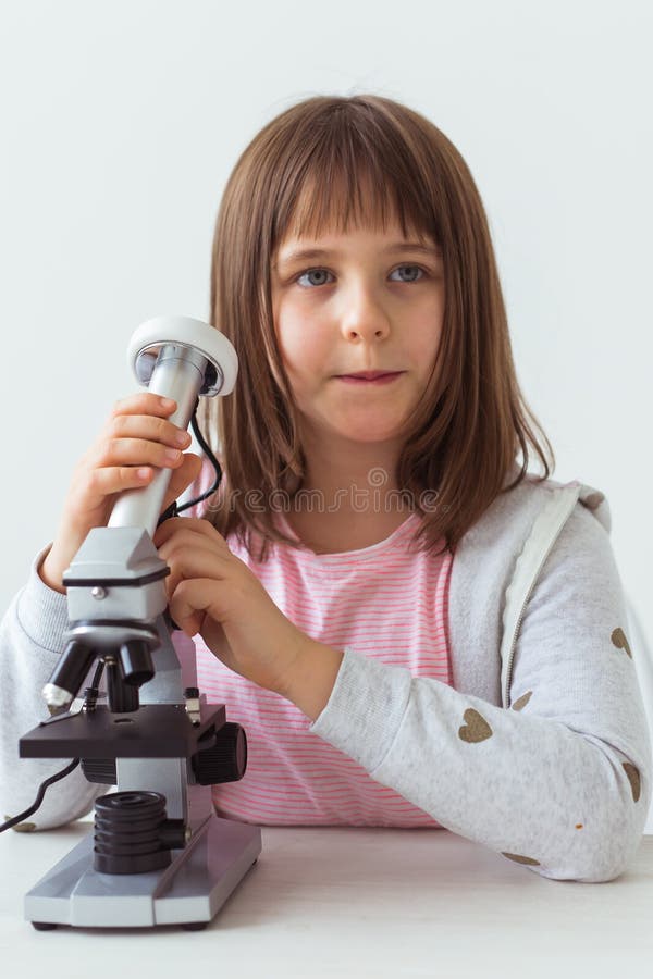 Child Girl in Science Class Using Digital Microscope. Technologies ...