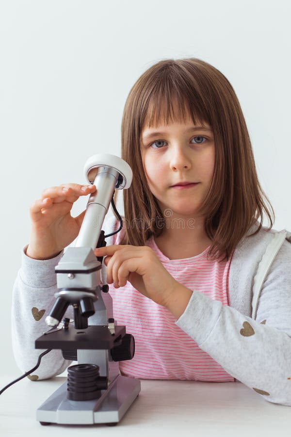 Child Girl in Science Class Using Digital Microscope. Technologies ...