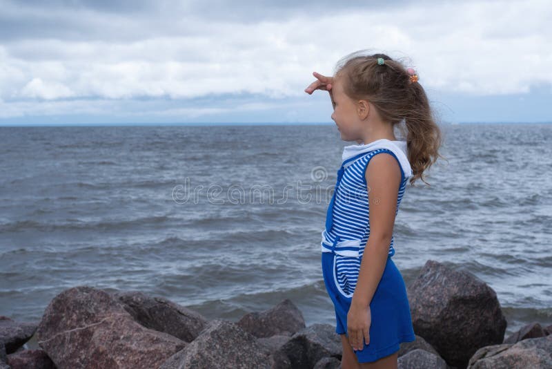 Child Girl on the Sea before the Storm, Strong Wind Stock Photo - Image ...