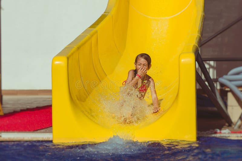 Child Sliding Down Water Slide in Pool Stock Image - Image of health ...