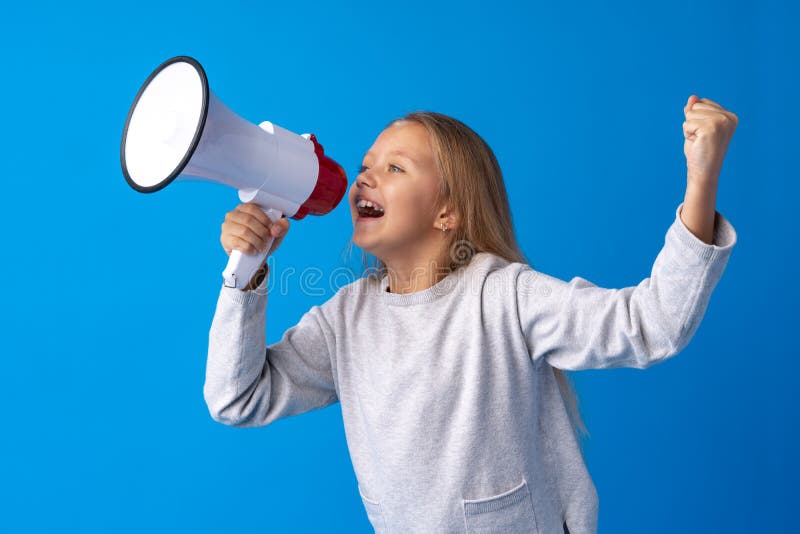Child Girl Using Megaphone Against Blue Background Stock Photo - Image ...
