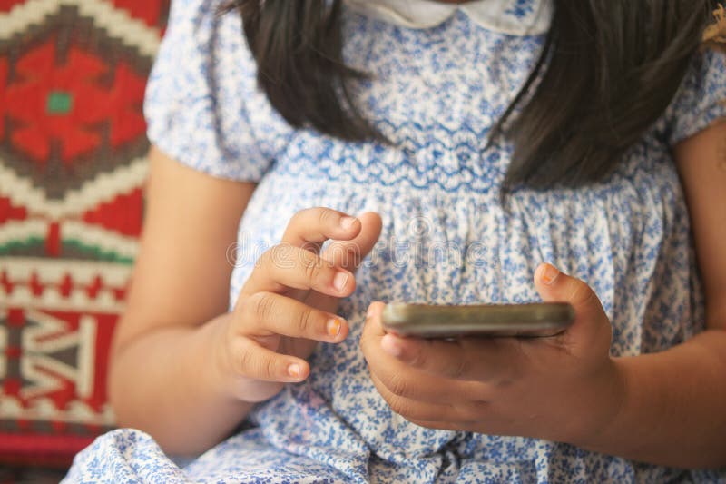 Child Girl Watching Cartoon on Smart Phone Stock Image - Image of couch ...