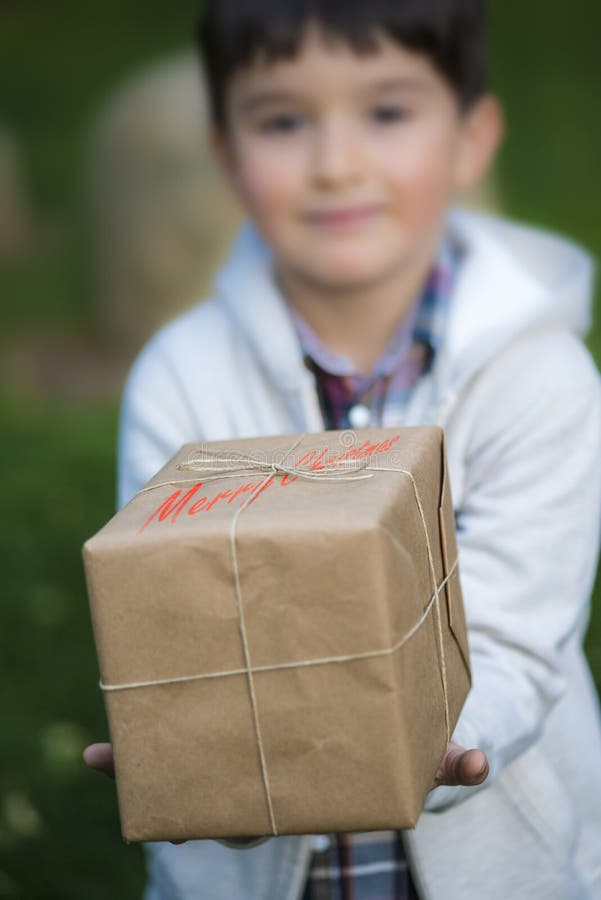 Child Giving a Christmas Gift Stock Image - Image of wrapped, holiday ...