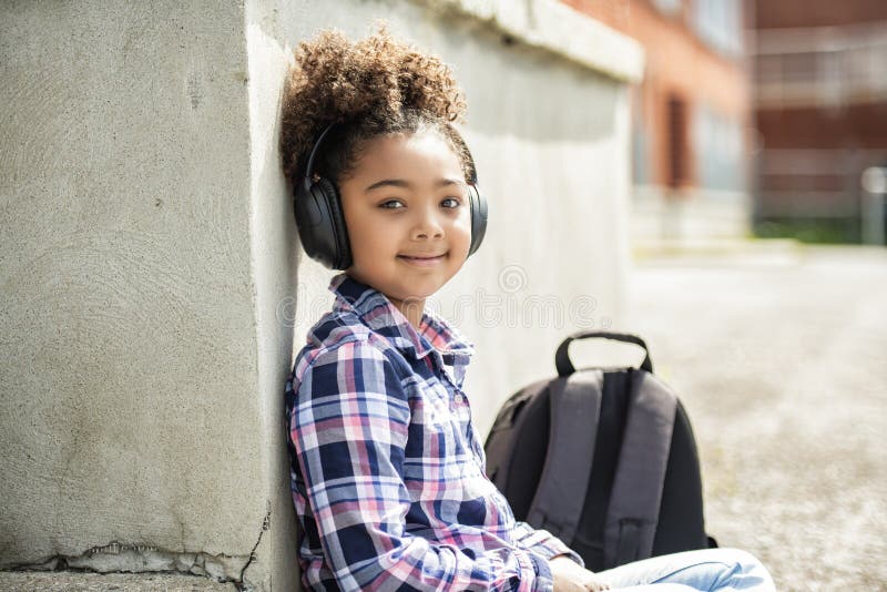 Child Going Back To School with a Backpack Listening Music Stock Photo ...