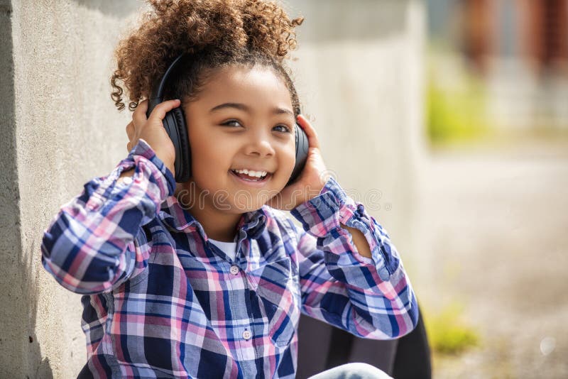 Child Going Back To School with a Backpack Listening Music Stock Photo ...