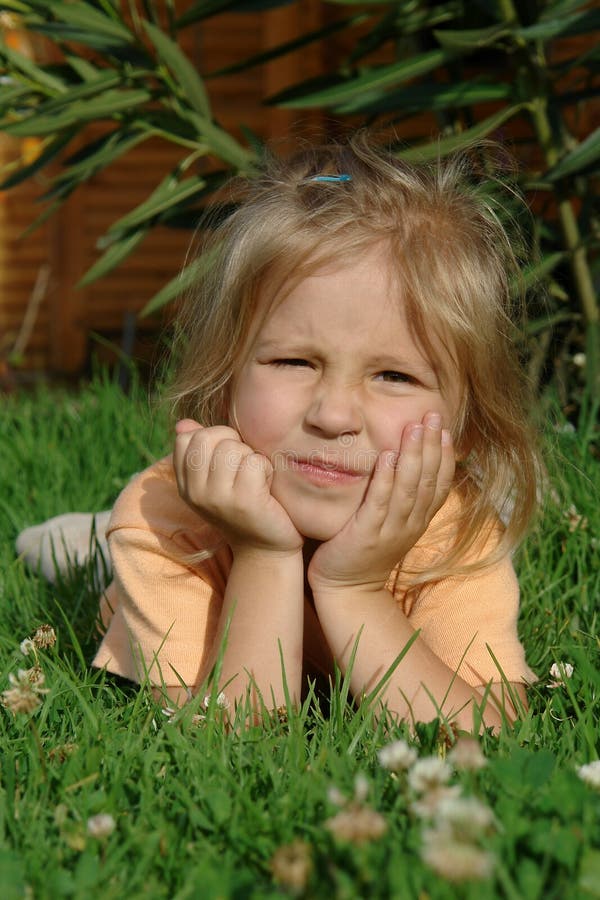 Child on grass stock image. Image of green, hands, eyes - 1095951