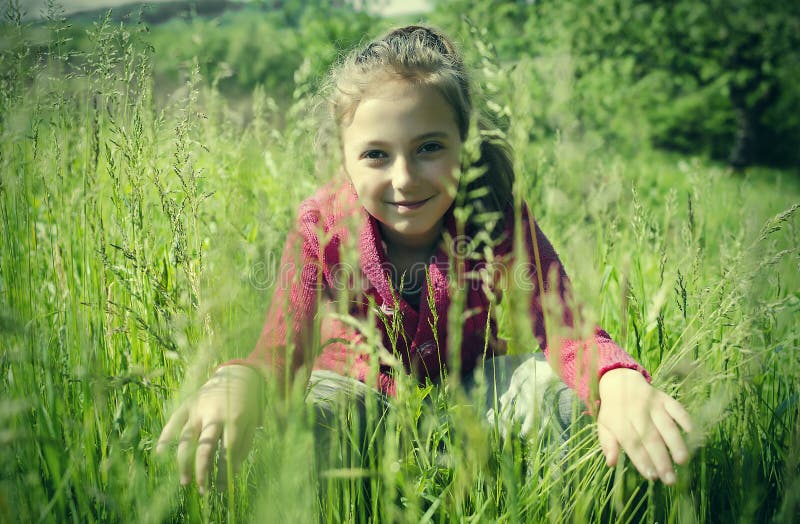 Child on the grass stock image. Image of flower, happiness - 40368809
