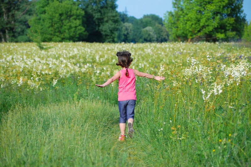 Child on Green Spring Meadow, Kid Running and Having Fun Stock Image ...