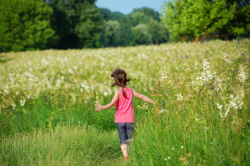 Child on Green Spring Meadow, Kid Running and Having Fun Stock Photo ...