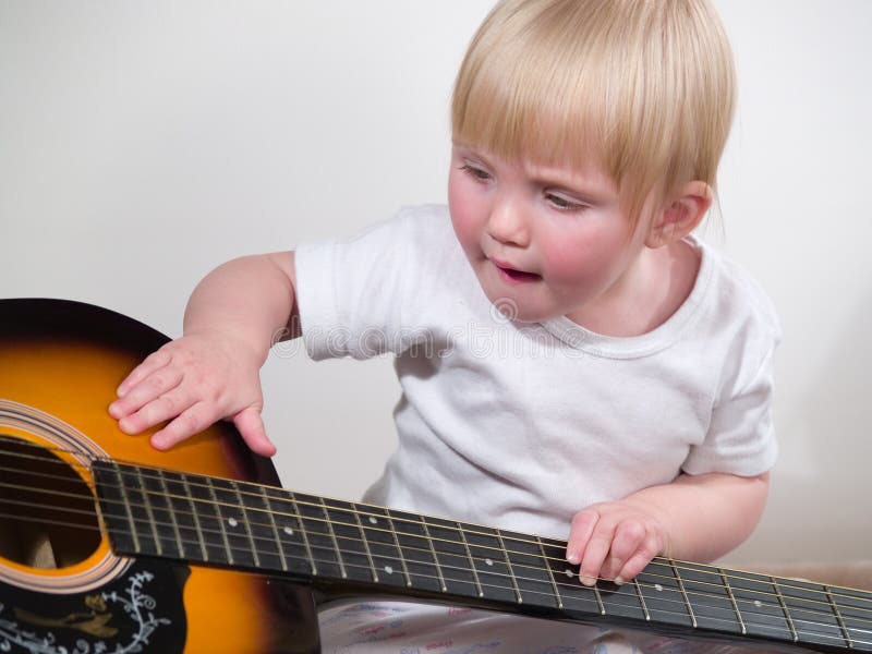 Child and guitar stock image. Image of acoustic, indoors - 7688977