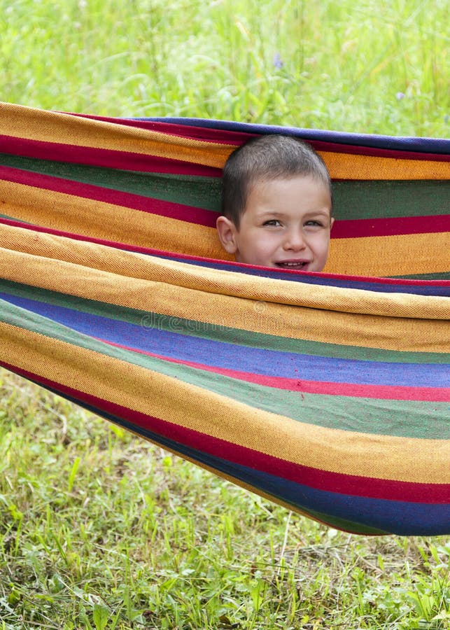 Boy relaxing in hammock stock photo. Image of lawn, summer - 14685524