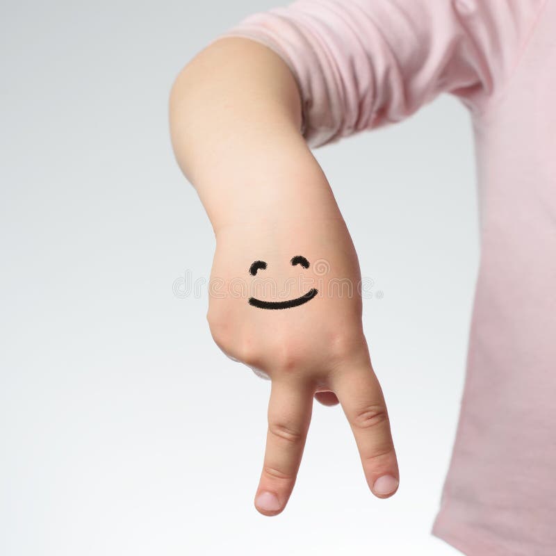 Child hand with funny face stock photo. Image of human - 181151112