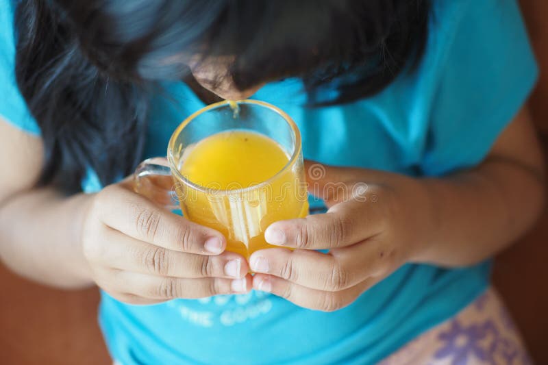 Child Hand Holding a Glass of Orange Juice Stock Photo - Image of hold ...